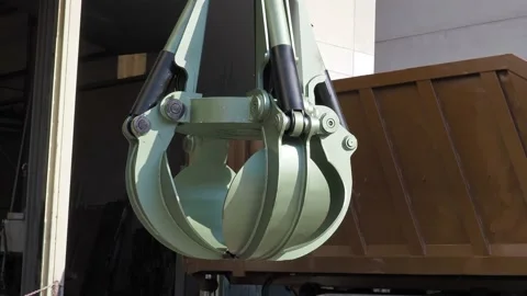 Industrial claw arm in junkyard opening ... | Stock Video | Pond5