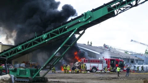 industrial fire at mulch plant with fire... | Stock Video | Pond5