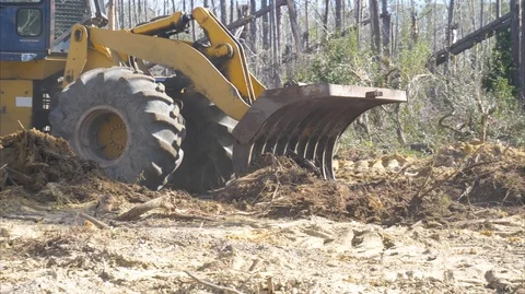 Industrial root rake on front end loader... | Stock Video | Pond5