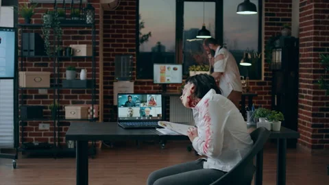 Infected creepy zombie sitting at desk w... | Stock Video | Pond5
