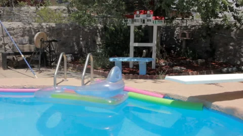 Inflatable Pool Raft and Noodles Float i... | Stock Video | Pond5