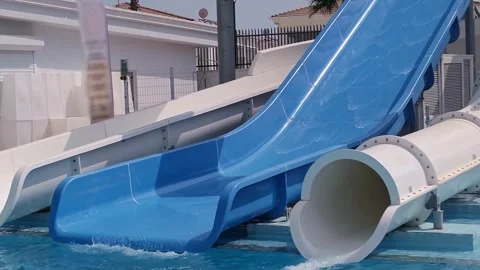 Inflatable water slides provide aquatic ... | Stock Video | Pond5
