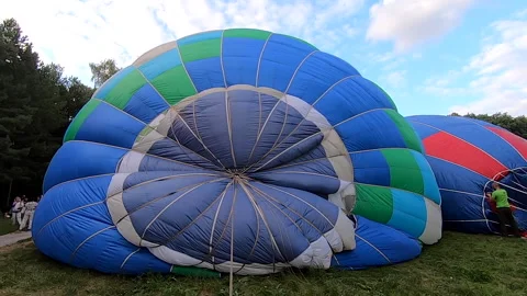 Inflating balloon lying ground. Large bl... | Stock Video | Pond5