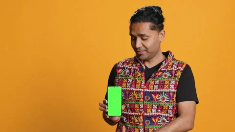 Influencer presenting green screen phone... | Stock Video | Pond5
