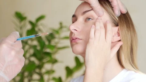 Injection into the eyelid the eyes of th... | Stock Video | Pond5