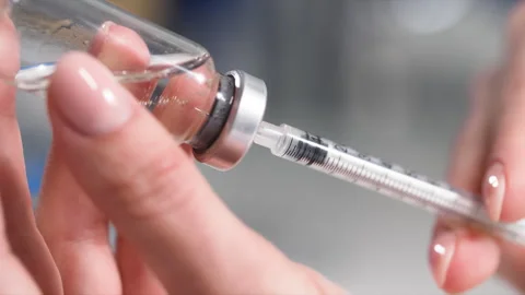 injections, young woman draws medicine f... | Stock Video | Pond5