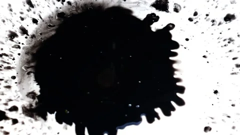 Ink blot spreading on a white screen | Stock Video | Pond5