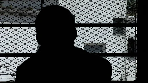 Inmate Looking Through Window Bars insid... | Stock Video | Pond5