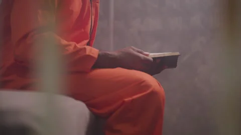 Inmate Reading A Book In His Cell | Stock Video | Pond5