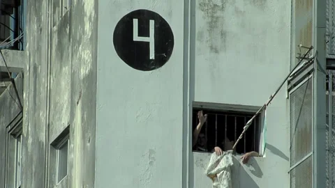 Inmates Looking Through Window Bars in a... | Stock Video | Pond5