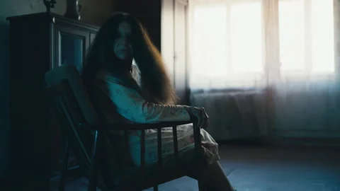 Insane old woman rocking in armchair, al... | Stock Video | Pond5