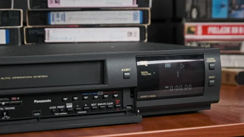 Insert VHS Cassette into VCR and Push Pl... | Stock Video | Pond5