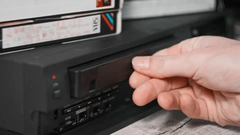 Insert VHS Cassette into VCR Player and ... | Stock Video | Pond5
