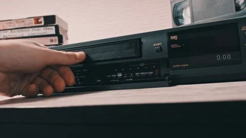 Insert VHS Cassette Into VCR Video Playe... | Stock Video | Pond5