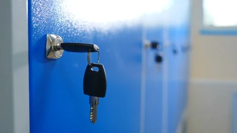 Inserted keys in iron locker doors in gy... | Stock Video | Pond5