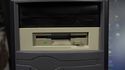 Inserting and ejecting a vintage compute... | Stock Video | Pond5