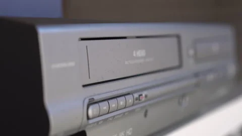 Inserting and Playing Video Cassette Tap... | Stock Video | Pond5