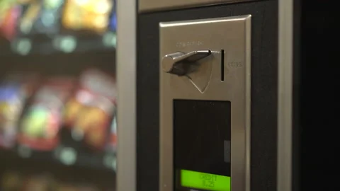 Inserting coins into vending machine to ... | Stock Video | Pond5