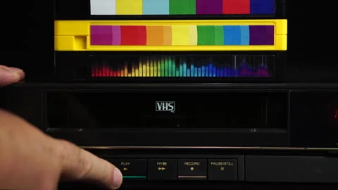 Inserting Colorful VHS Video Cassette Ta... | Stock Video | Pond5