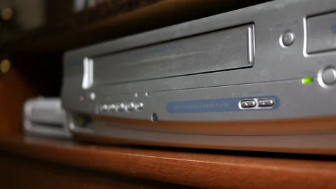 Inserting a VHS Tape into VHS player - n... | Stock Video | Pond5