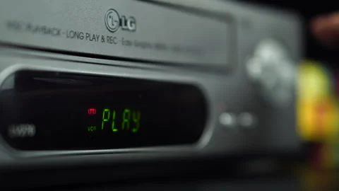 Inserting VHS Video Cassette Tape Into V... | Stock Video | Pond5