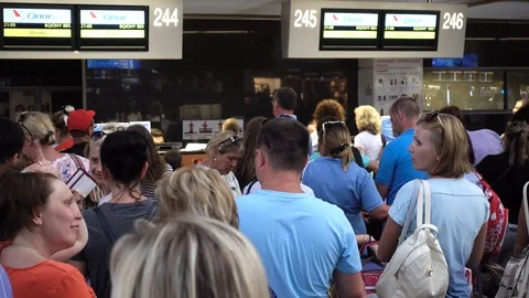 Inside the airport terminal. A large cro... | Stock Video | Pond5