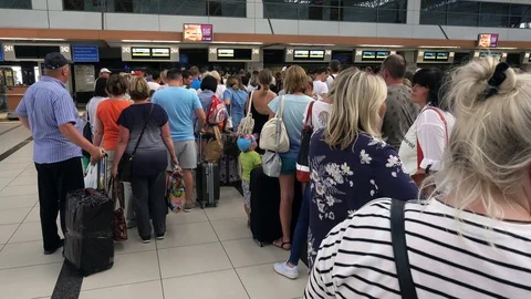 Inside the airport terminal. A large cro... | Stock Video | Pond5