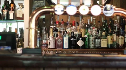 Inside a British pub. Beer taps and Drin... | Stock Video | Pond5