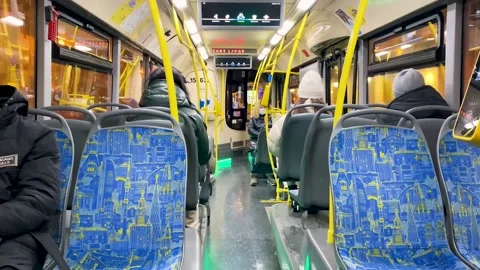 Inside the city bus in the evening. Pass... | Stock Video | Pond5