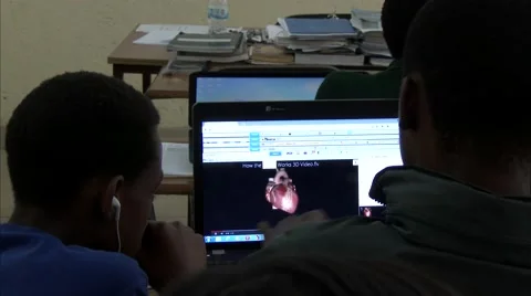 Inside a classroom kids watching a movie... | Stock Video | Pond5