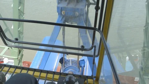 Inside a cranes cockpit. The crane unlo... | Stock Video | Pond5