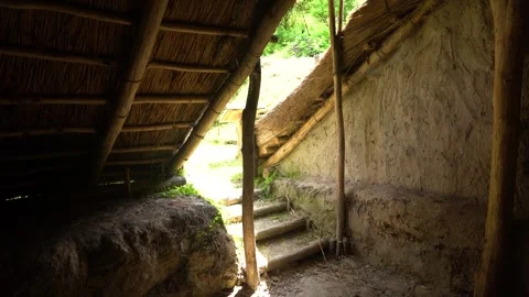 Inside view of sloped earthen hut with b... | Stock Video | Pond5