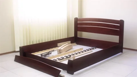 installation of a double wooden bed | Stock Video | Pond5