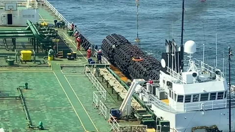 Installation of fenders prior ship to sh... | Stock Video | Pond5