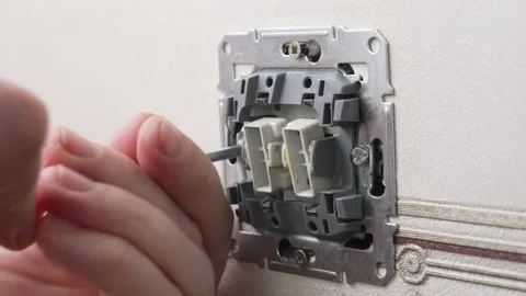 Installation of a switch. repair of elec... | Stock Video | Pond5