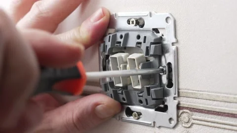 Installation of a switch. repair of elec... | Stock Video | Pond5