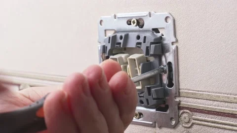 Installation of a switch. repair of elec... | Stock Video | Pond5