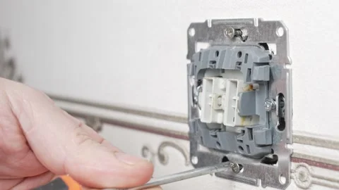 Installation of a switch. repair of elec... | Stock Video | Pond5