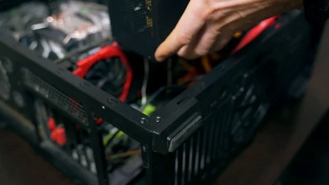 Installing the power supply in the syste... | Stock Video | Pond5
