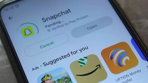 Installing Snapchat mobile app on phone ... | Stock Video | Pond5