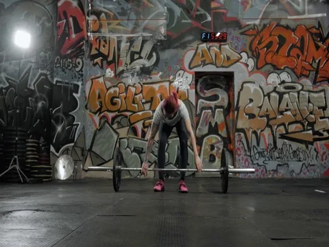Intense workout in dark gym: strained yo... | Stock Video | Pond5