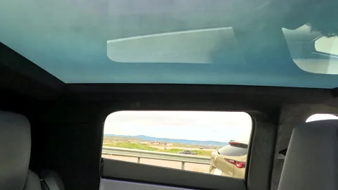 Interior View of Driving a Tesla Cybertr... | Stock Video | Pond5