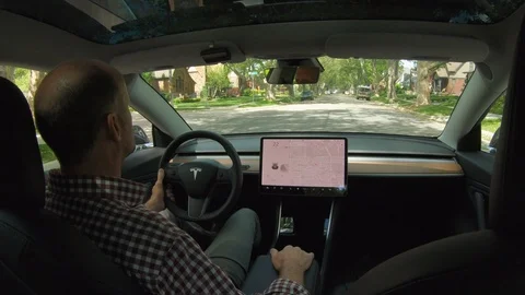 Interior view of a man driving a Tesla M... | Stock Video | Pond5