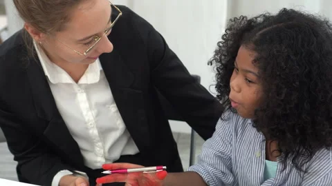 International school teacher working wit... | Stock Video | Pond5