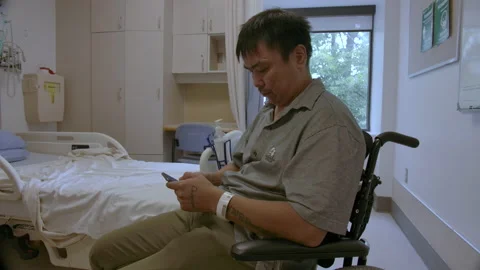 Inuit man in hospital room using smart p... | Stock Video | Pond5