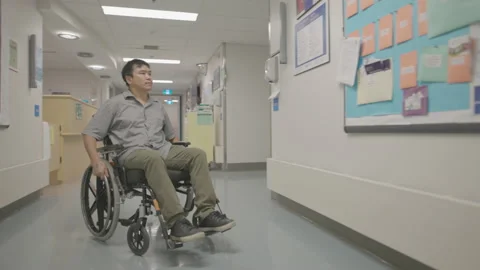 Inuit man in a hospital wheel chair | Stock Video | Pond5