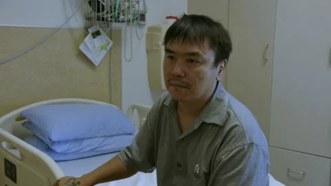 Inuit man sitting on hospital bed waitin... | Stock Video | Pond5