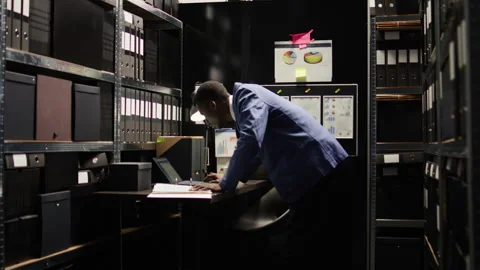 Investigator analyzes clues and evidence | Stock Video | Pond5