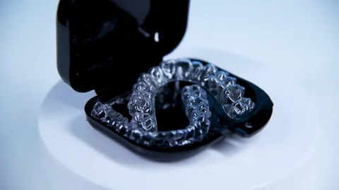 Invisalign transparent aligners rotate i... | Stock Video | Pond5