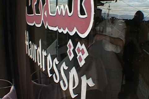 Iraqi Barber shop sign in Arabic on shop... | Stock Video | Pond5